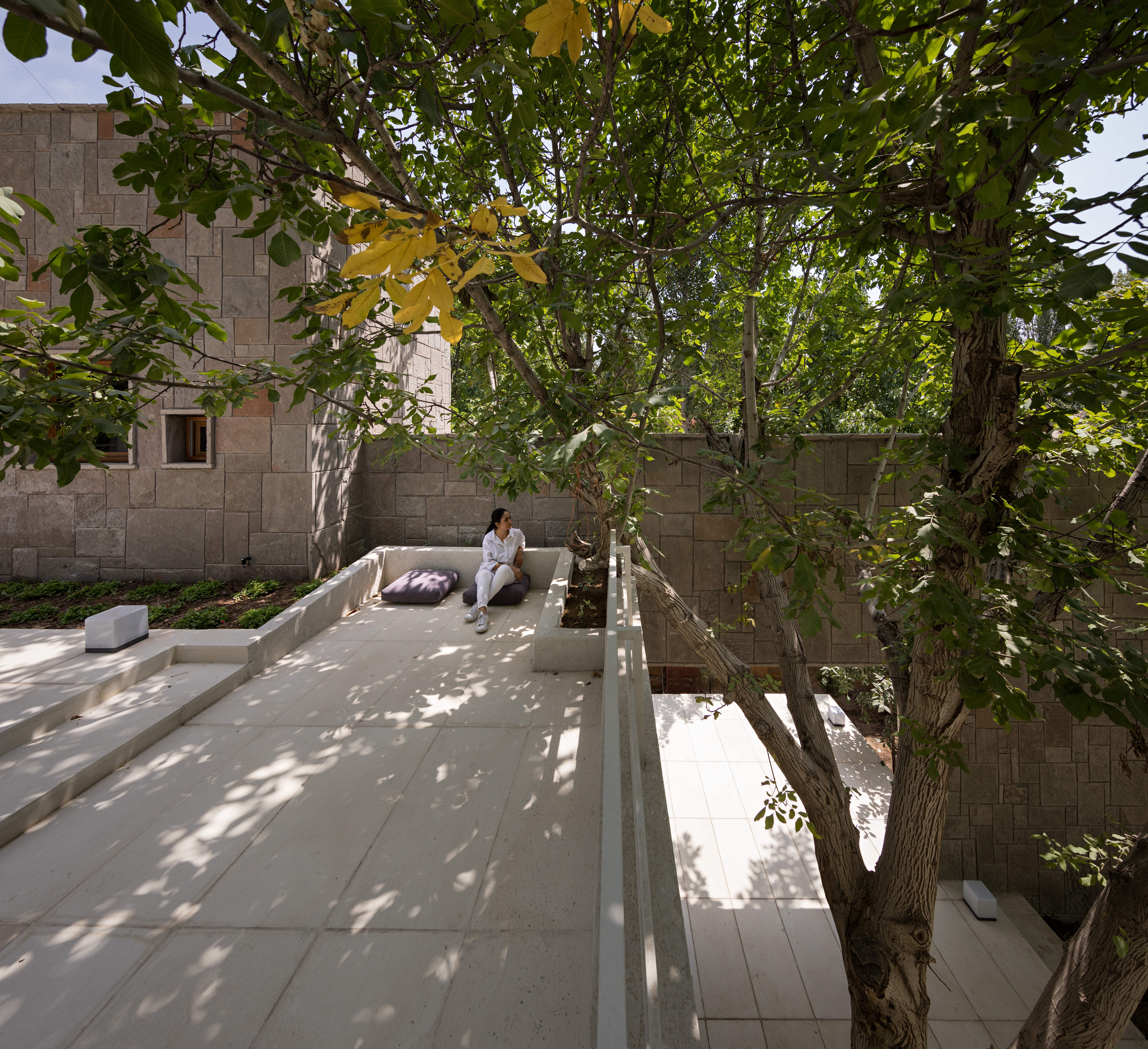 A house between two walnuts by KAV Architects - Architizer