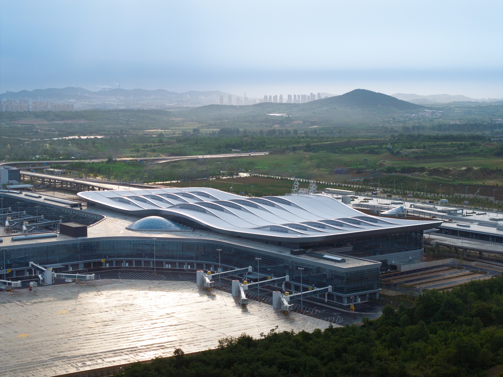 Aedas completed Yantai Penglai International Airport Terminal 2 by Aedas - Architizer