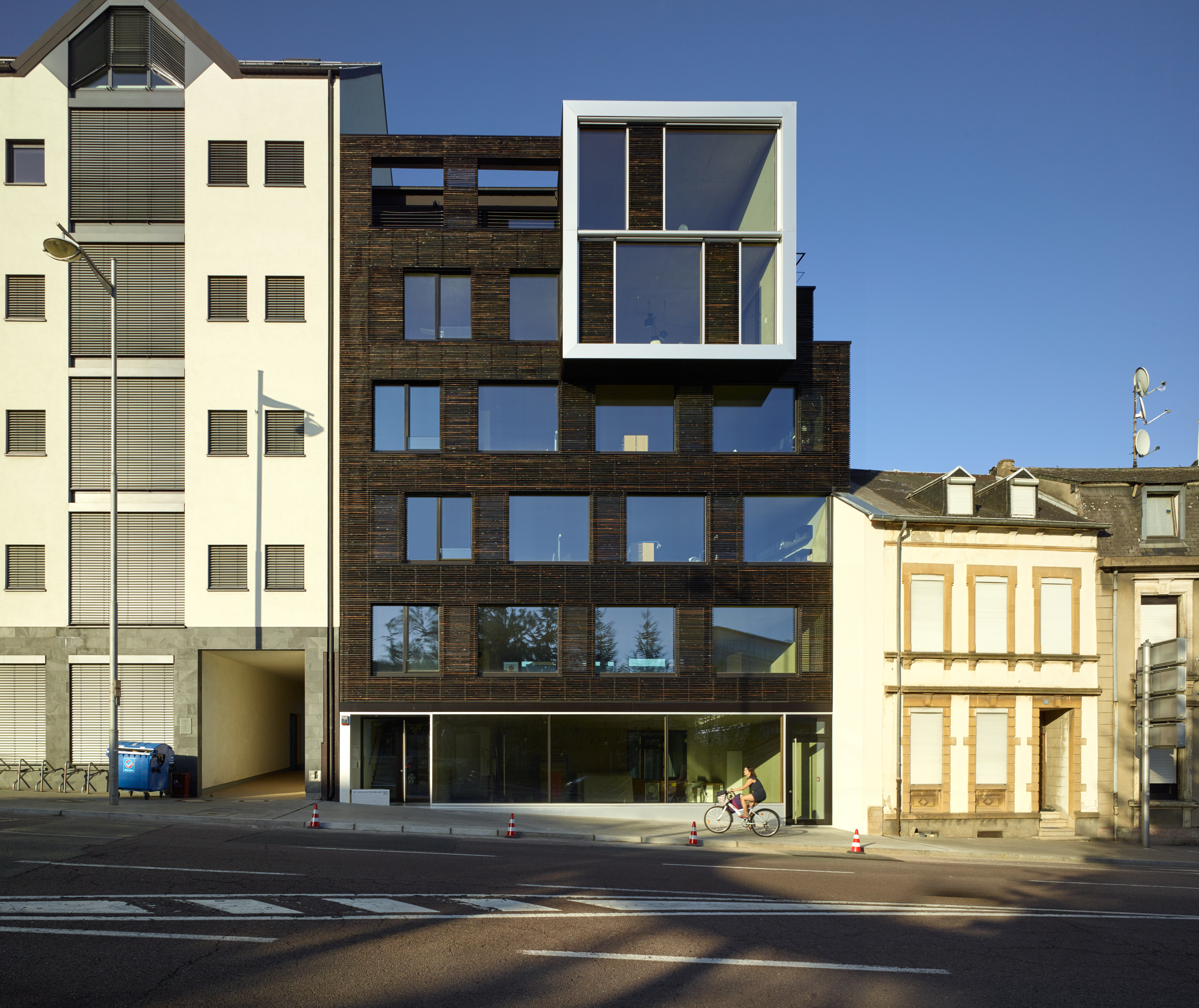 Rocade_Office & retail building with burnt wood facade yakisugi by ...