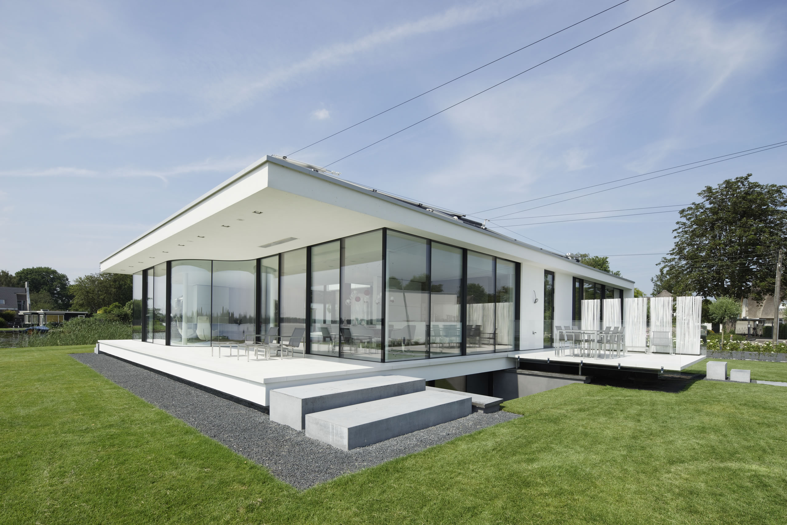 G House: lakeside villa and guest accommodation by Lab32 architecten ...