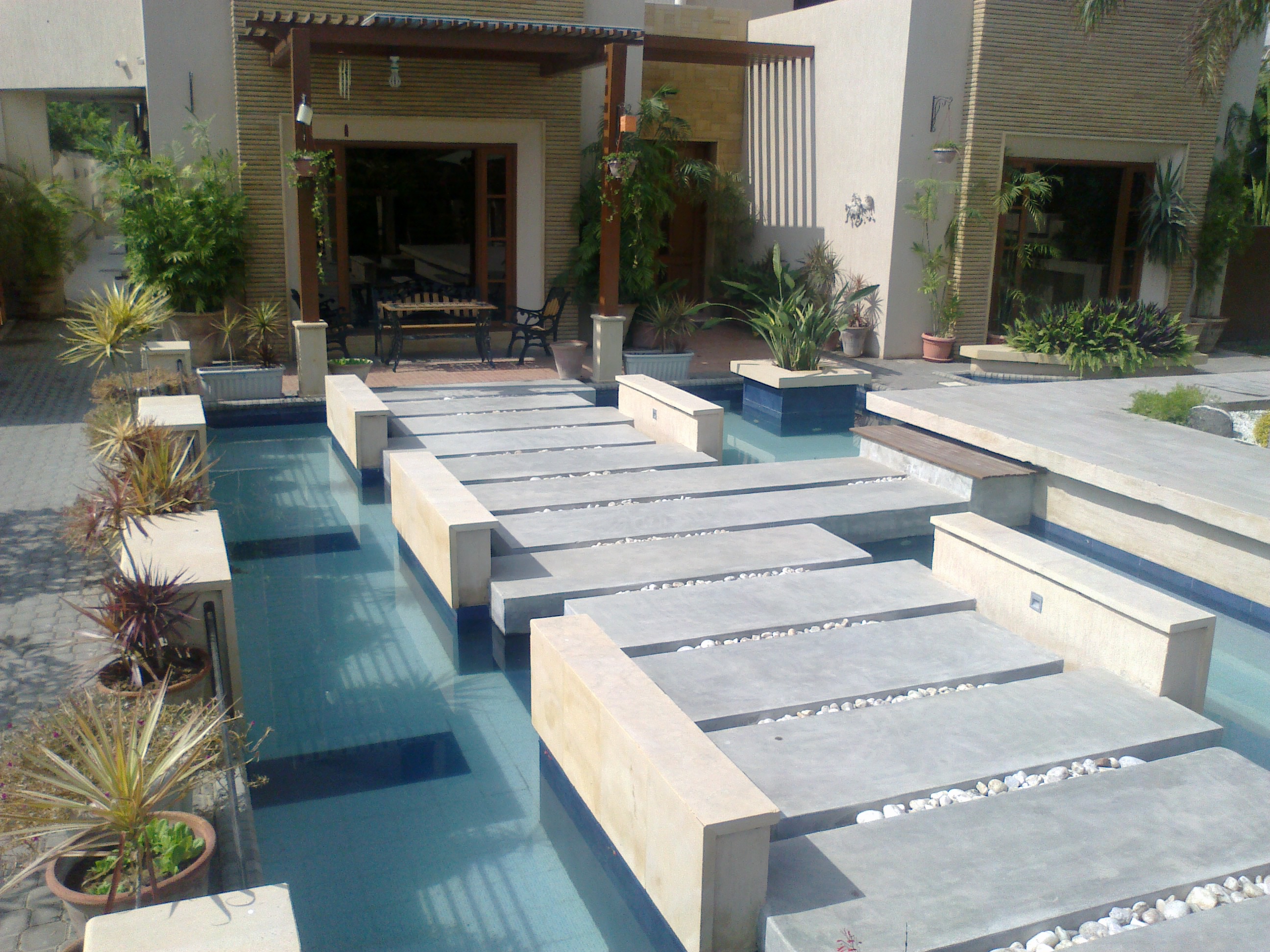 Home entrance with a water feature and landscape by shadzynz - Architizer