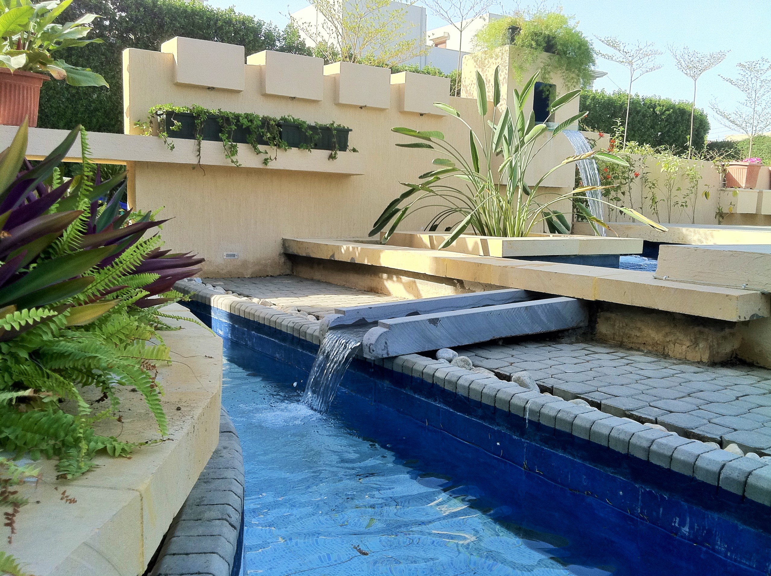 Home entrance with a water feature and landscape by shadzynz - Architizer
