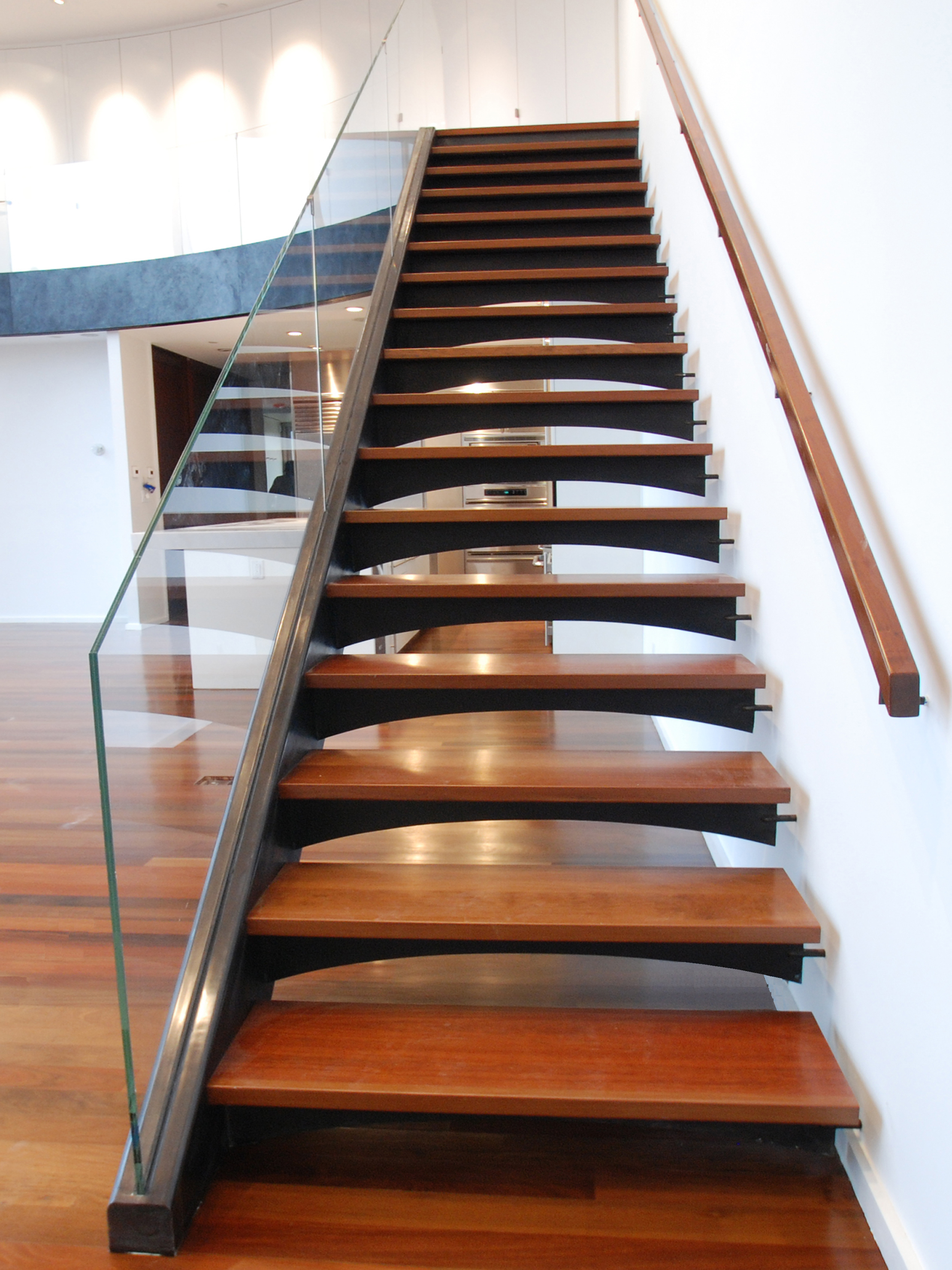 Blacked steel staircase with mezzanine by Serett Metalworks Corp ...