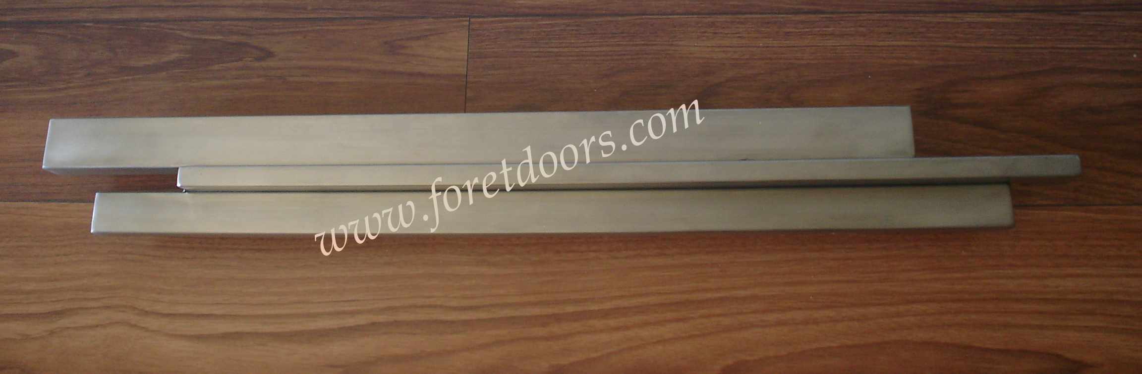 Modern stainless steel pulls by Foret Doors - Architizer