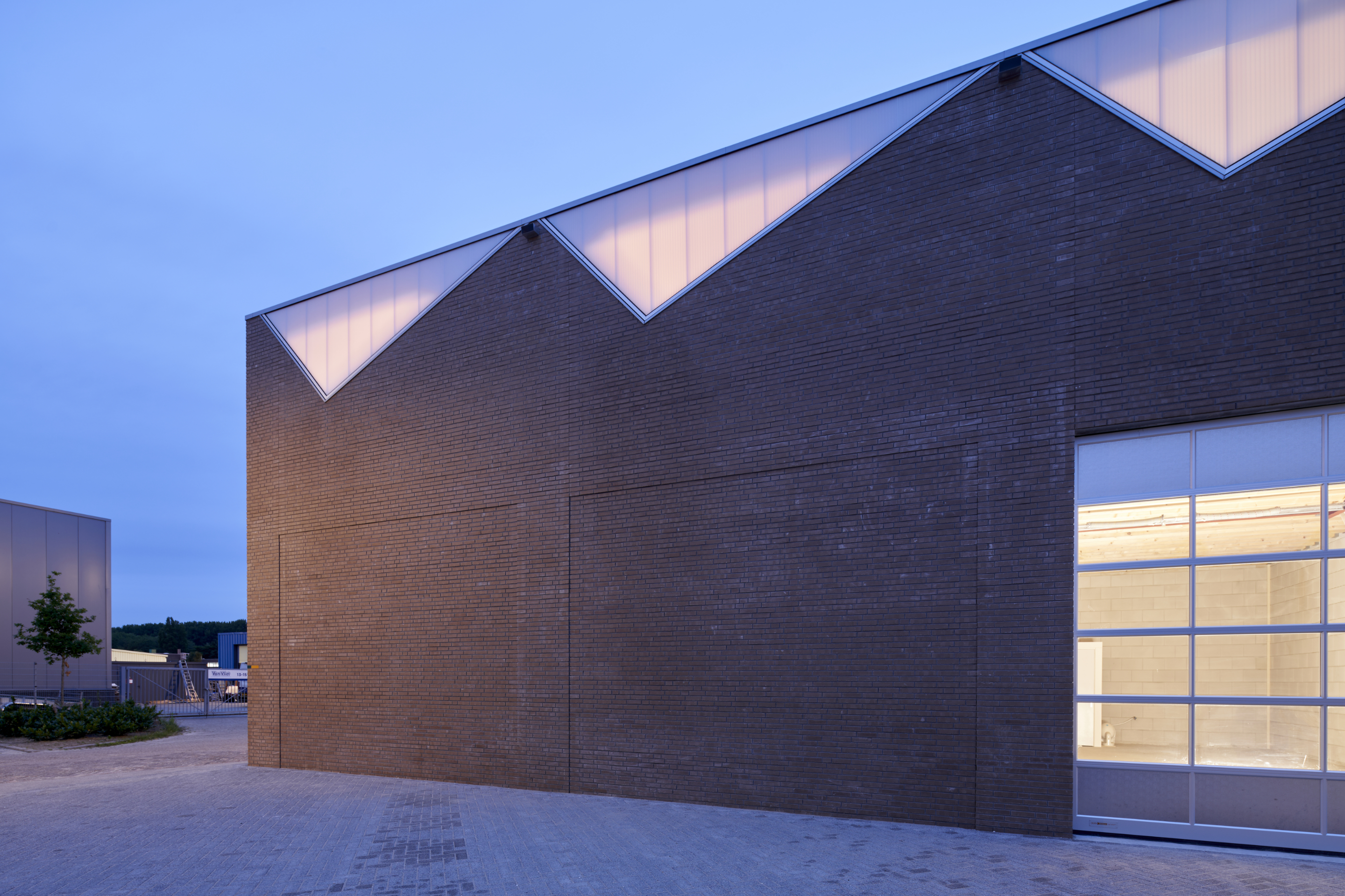 beautiful industrial building based on the qualities of the sawtooth ...