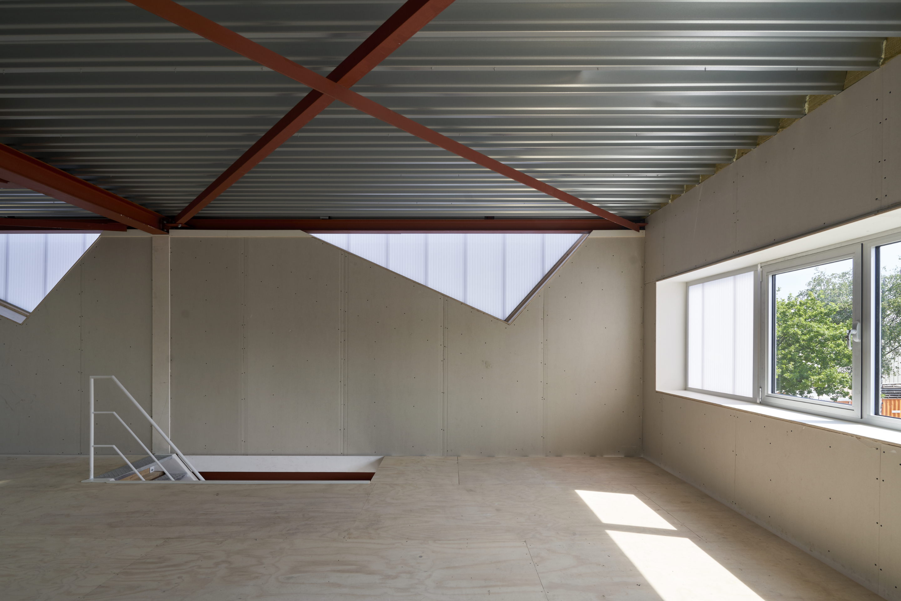 beautiful industrial building based on the qualities of the sawtooth ...