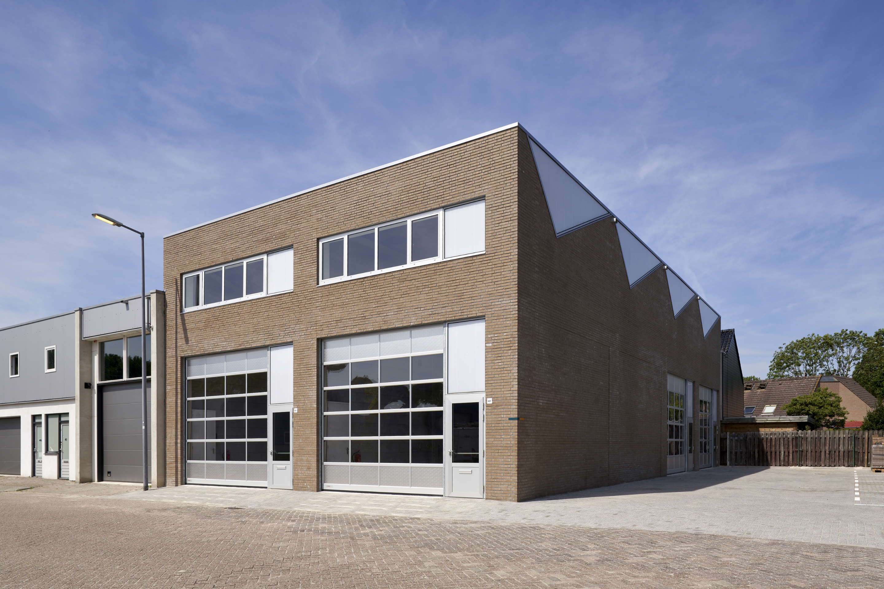 beautiful industrial building based on the qualities of the sawtooth ...