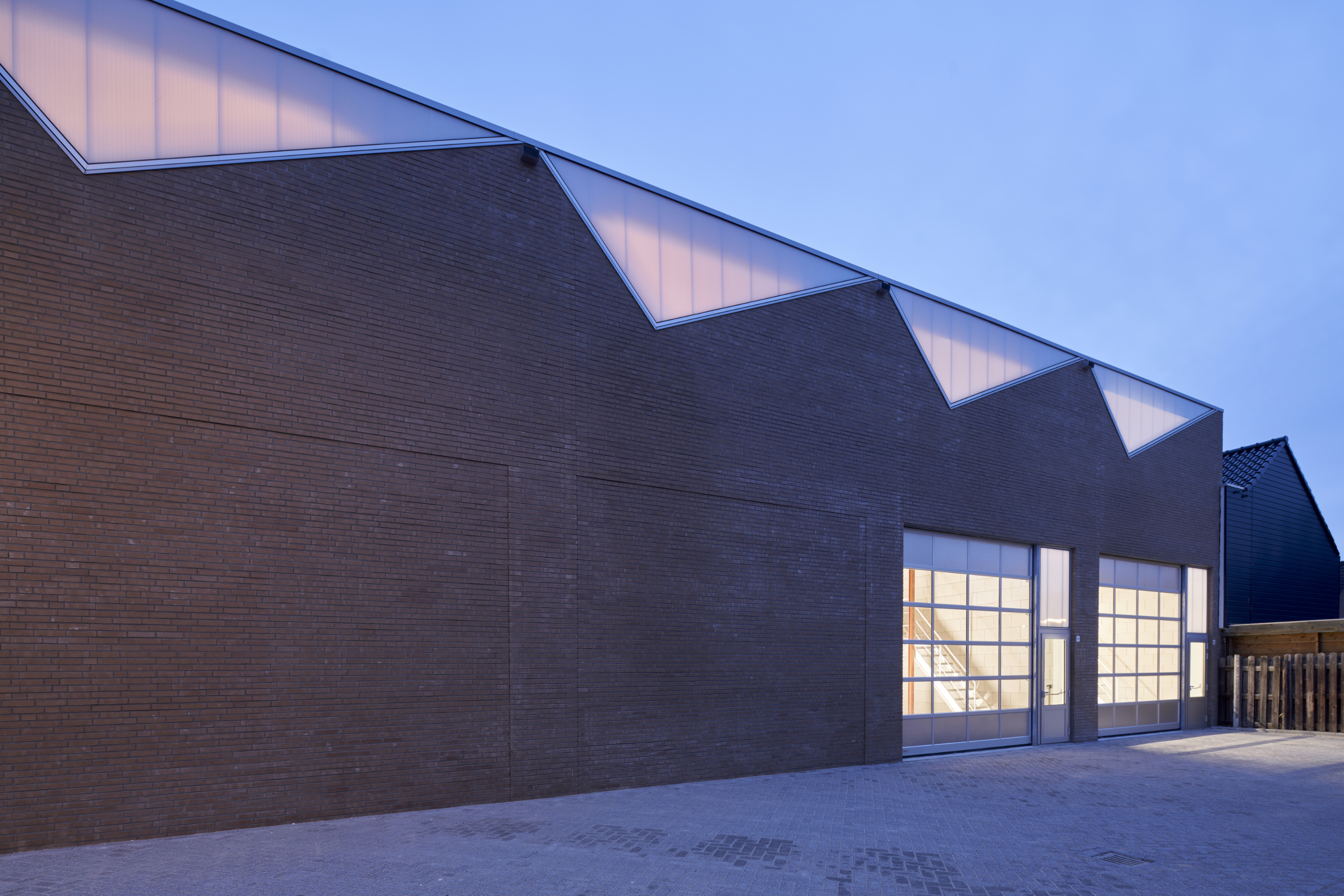 beautiful industrial building based on the qualities of the sawtooth ...