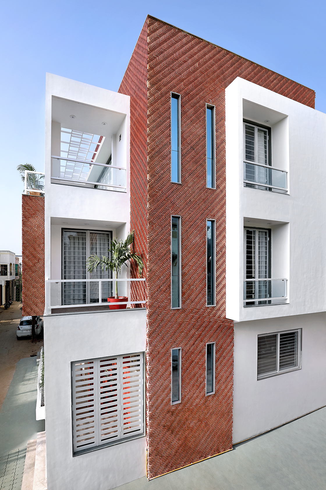 EARTHY RED COLORED WAVY CLAY TILES FACADE CLADDING by MANOJ PATEL ...