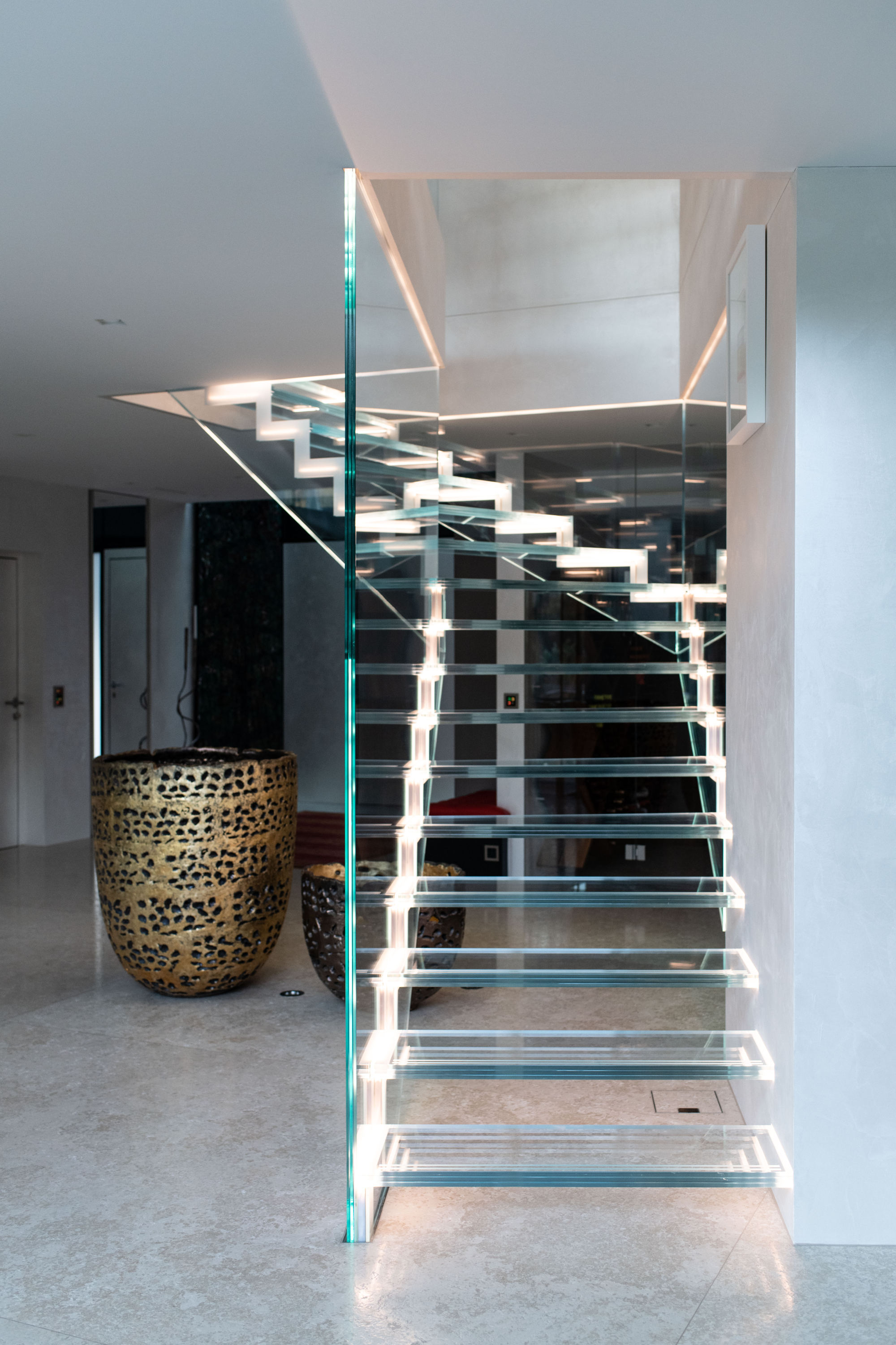 All glass stair with LED in Switzerland by Siller Stairs - Architizer