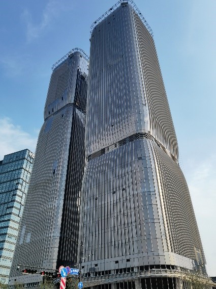 Twin-Tower Landmark Glittering at Hangzhou Qianjiang by Aedas - Architizer