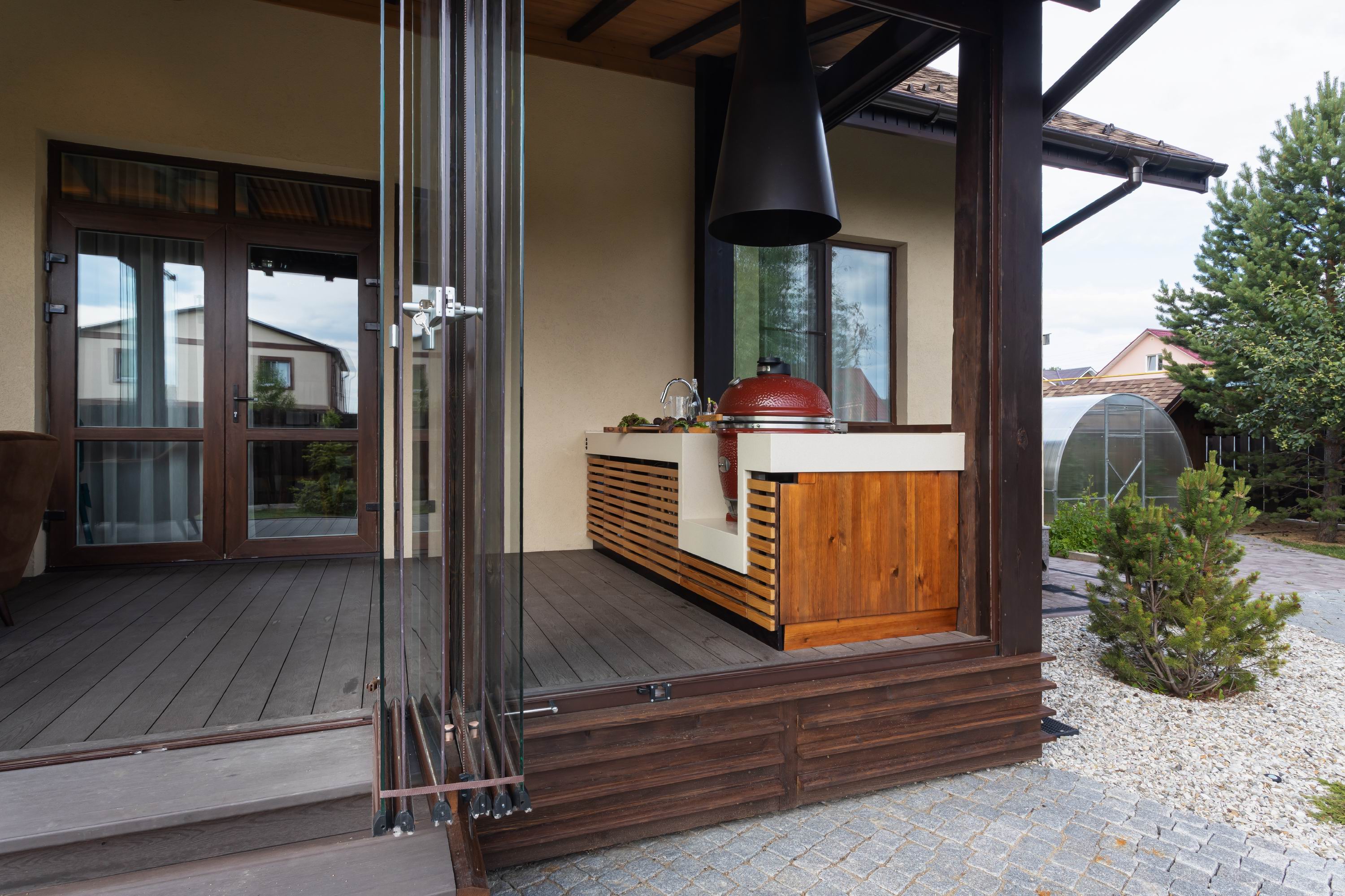 Terrace with swimming pool and summer kitchen in a country house by ...