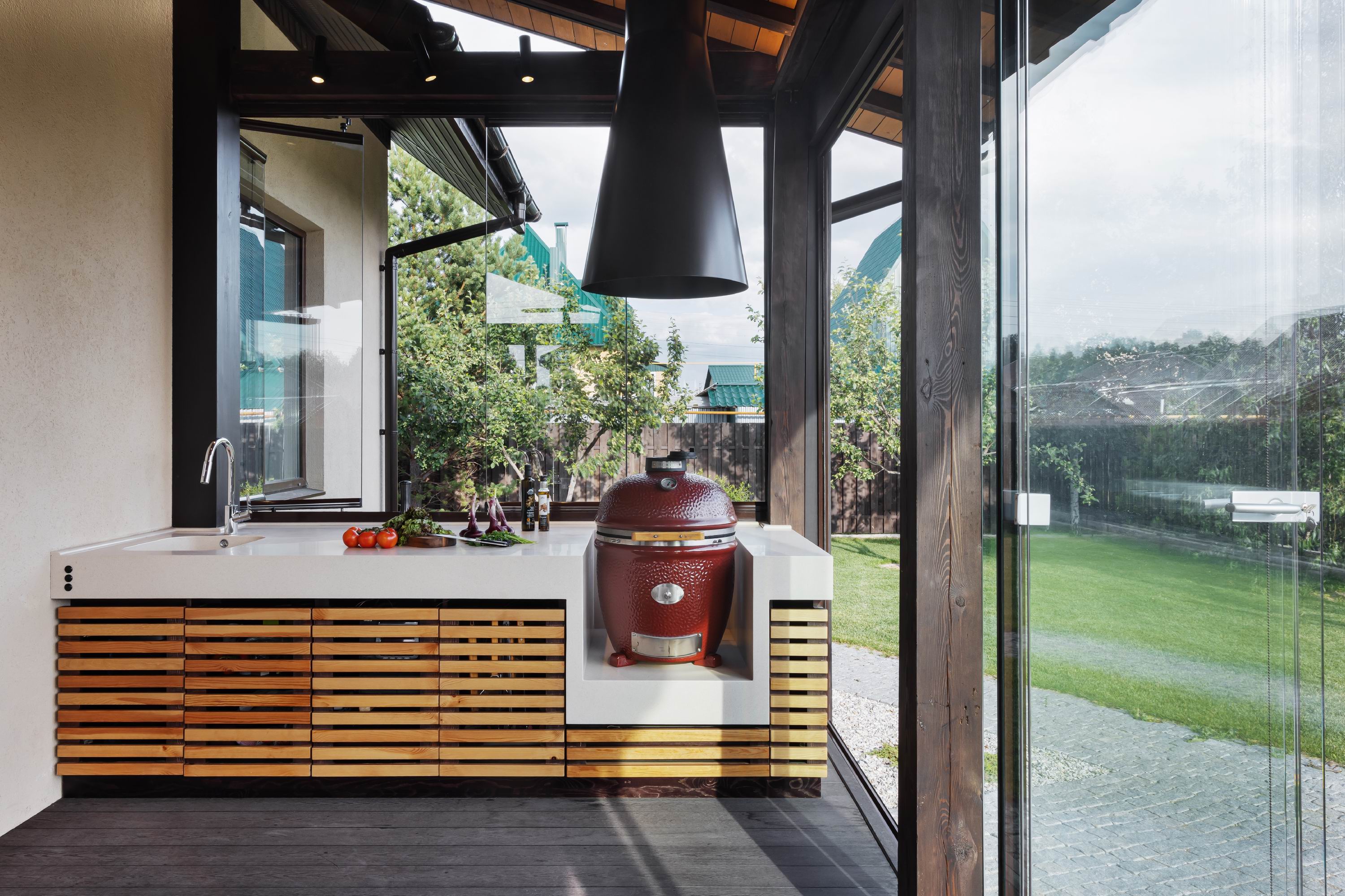 Terrace with swimming pool and summer kitchen in a country house by ...