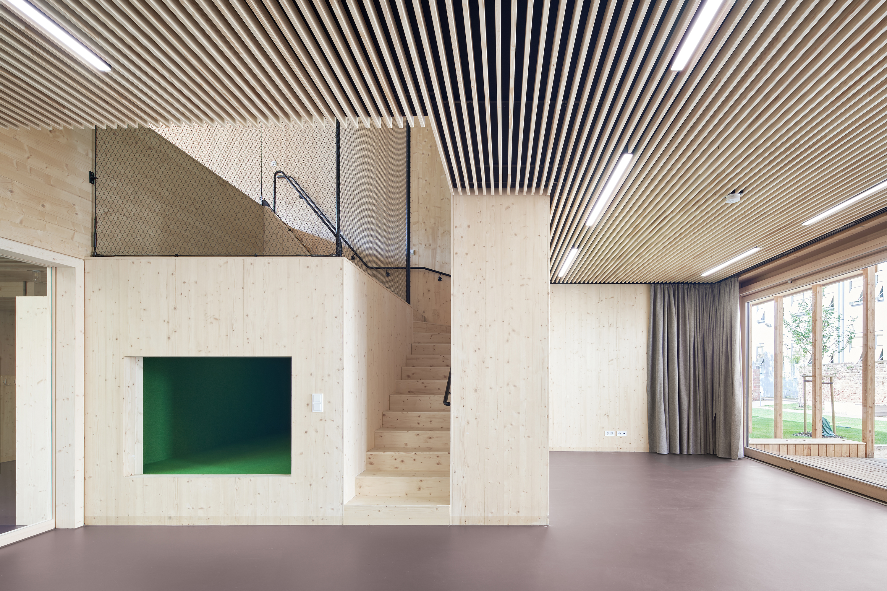 Day care center for children with family center by bez + kock ...