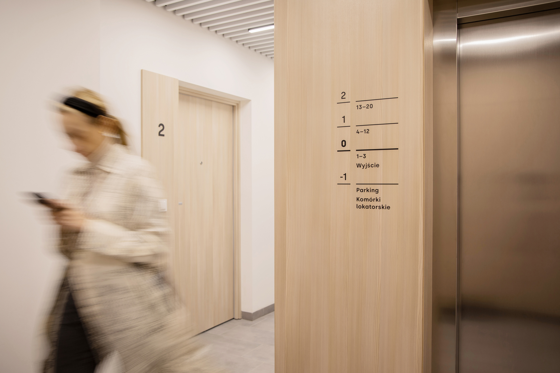 Wayfinding system for Włoskie Tarasy residential building in Warsaw by ...