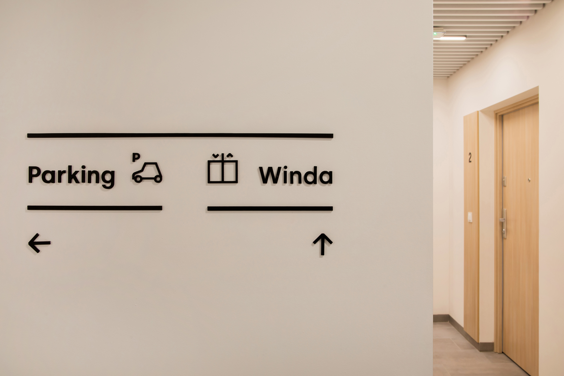 Wayfinding system for Włoskie Tarasy residential building in Warsaw by ...