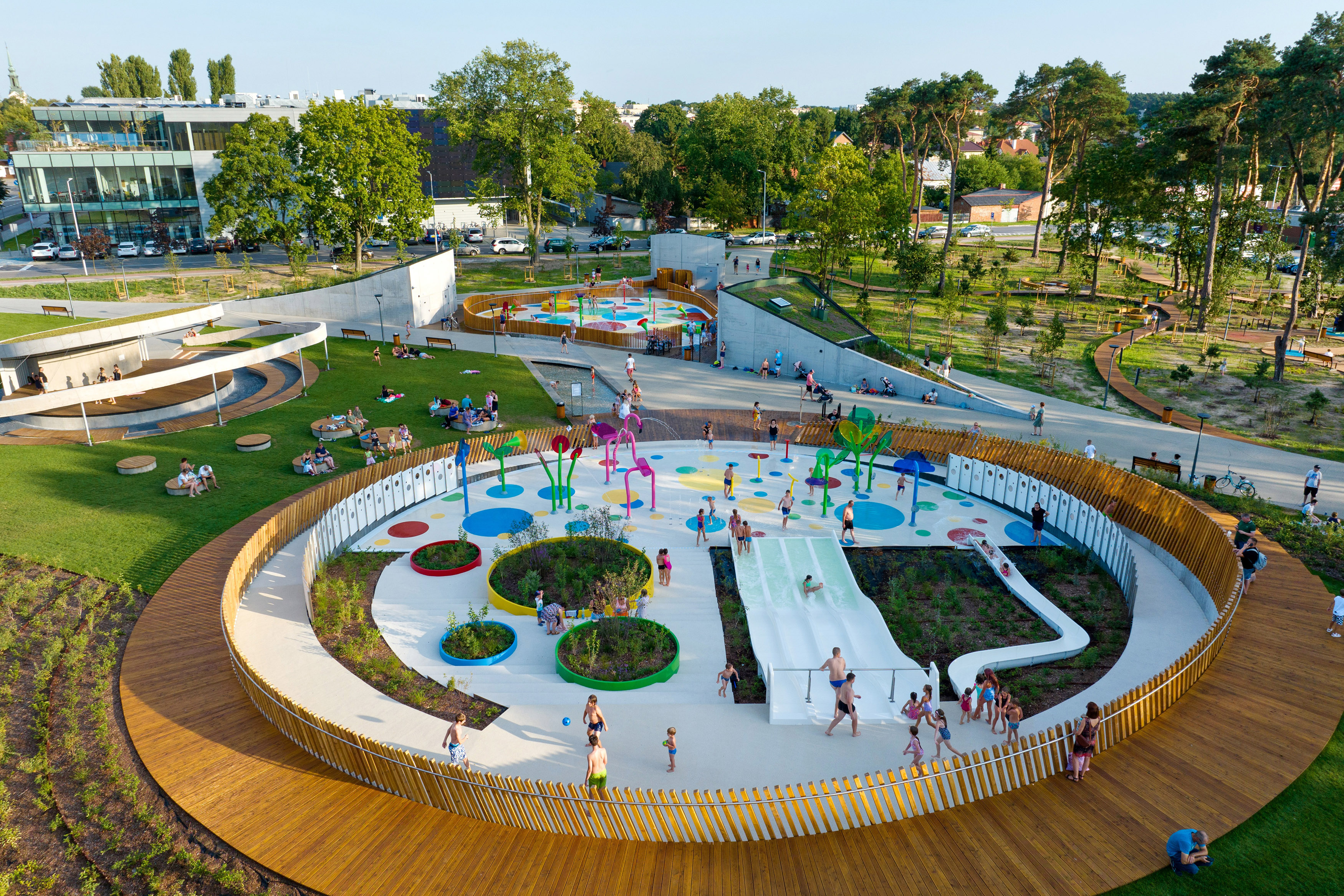 Recreation and sports park with water playgrounds by RS+ Robert Skitek ...