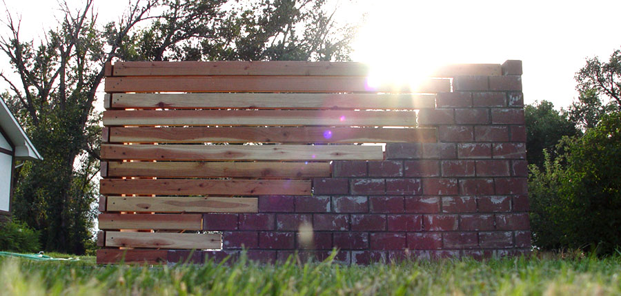 Brick + Wood Fence by studioellsworth. - Architizer